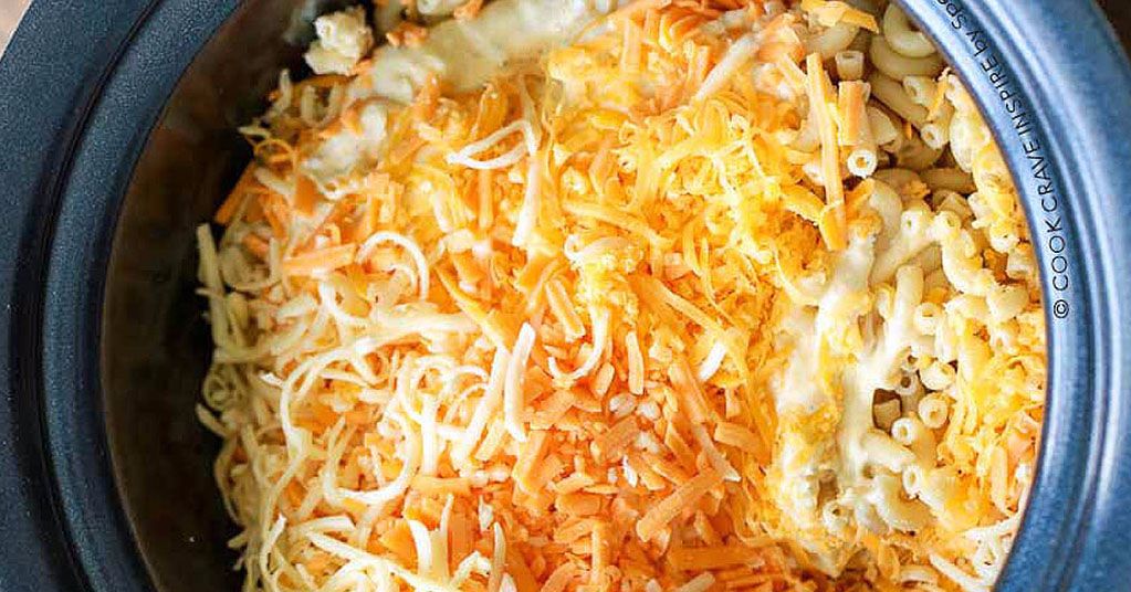 Pile the cheese in your slow cooker for a tasty macaroni delight ...