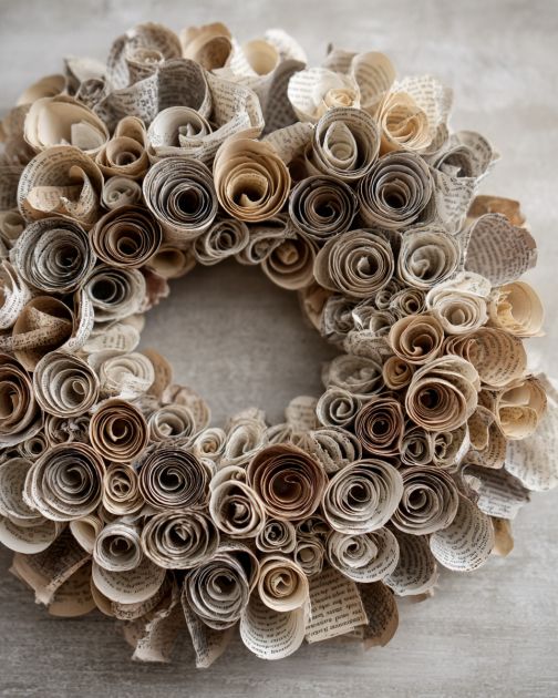 Curl old book pages into circles and glue them to a form. You won’t ...